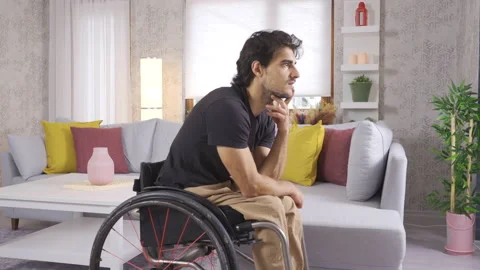 Sad disabled young man sitting in his wh... | Stock Video | Pond5