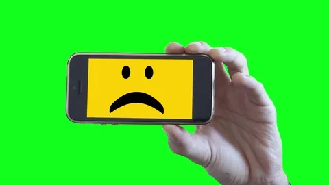 Sad Face Smartphone On Green Screen Back... | Stock Video | Pond5