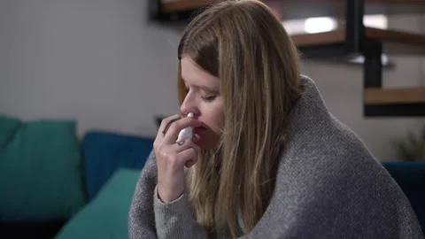Sad fatigue sick woman blowing nose spra... | Stock Video | Pond5