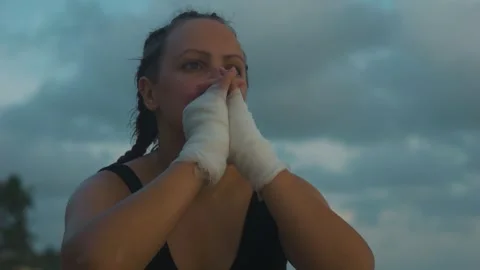 Sad female boxer MMA fighter on beach lo... | Stock Video | Pond5