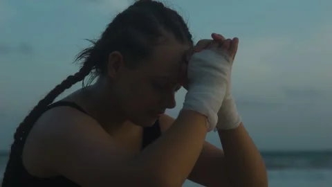 Sad female boxer MMA fighter on beach lo... | Stock Video | Pond5