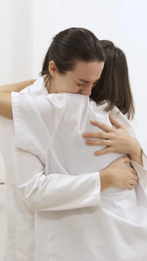 Sad female doctor crying while colleague... | Stock Video | Pond5