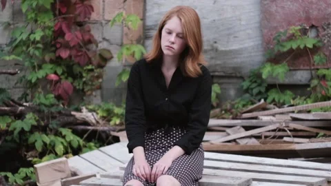 Sad ginger girl orphan thought. Homeless... | Stock Video | Pond5