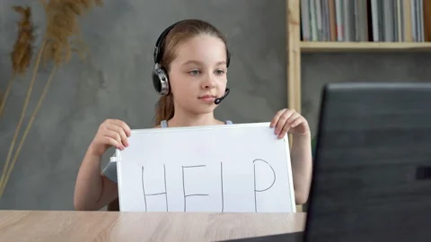 a sad girl sits at a computer laptop, su... | Stock Video | Pond5