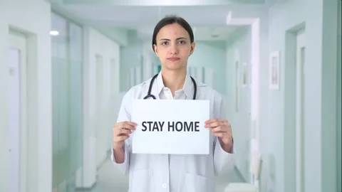 Sad Indian female doctor holding STAY HO... | Stock Video | Pond5