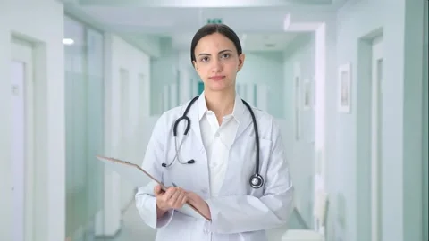 Sad Indian female doctor listening to pa... | Stock Video | Pond5