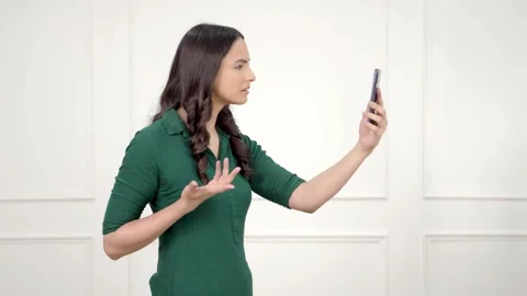 Sad Indian girl talking on a video call | Stock Video | Pond5