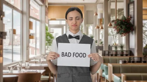 Sad Indian woman waiter holding BAD FOOD... | Stock Video | Pond5