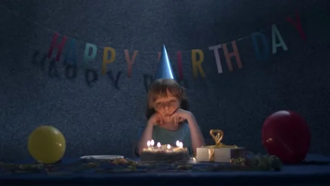 Sad kid on his birthday wandering with h... | Stock Video | Pond5