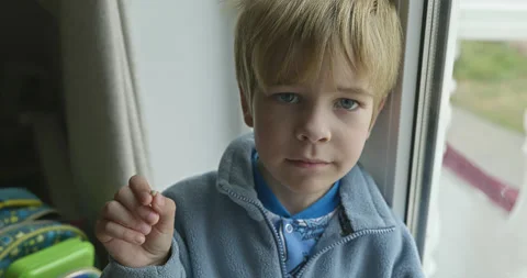 Sad Kid Holds in Hand Baby Tooth Upset B... | Stock Video | Pond5