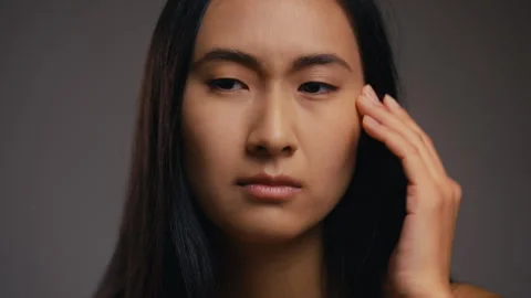 Sad Korean woman touching her face skin,... | Stock Video | Pond5