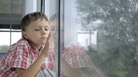 Sad Little Boy At Window Stock Video Footage | Royalty Free Sad Little ...
