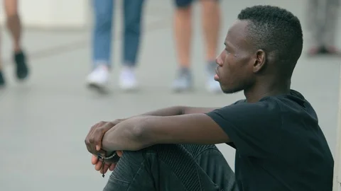 sad lonely young black african man sitti... | Stock Video | Pond5