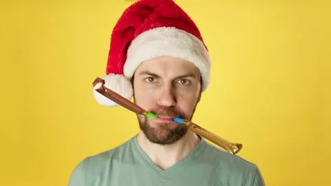 Sad man blows festive whistle wearing ch... | Stock Video | Pond5