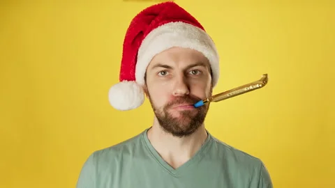 Sad man blows festive whistle wearing ch... | Stock Video | Pond5