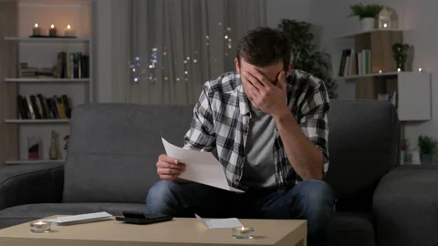 Sad man complaining reading a letter at ... | Stock Video | Pond5
