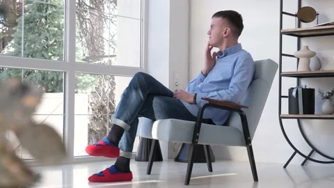 Sad man in depression sitting in a chair... | Stock Video | Pond5