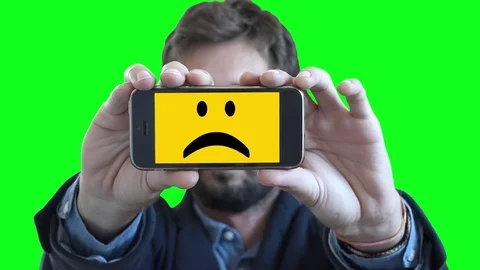 Sad Man Face In Smartphone Screen, Green... | Stock Video | Pond5