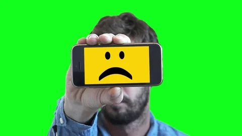 Sad Man With Smiley Face In Smartphone O... | Stock Video | Pond5