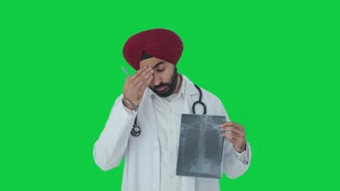 Sad Sikh Indian doctor explaining X ray ... | Stock Video | Pond5