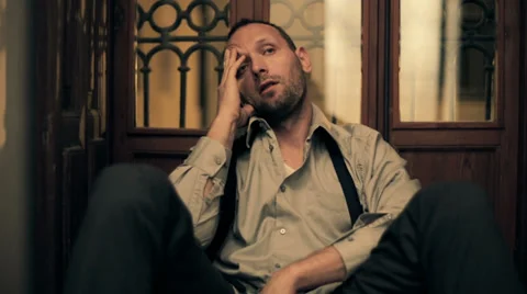 Sad tired businessman sitting on the flo... | Stock Video | Pond5