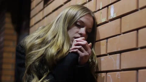 Sad woman cold in the night street, warm... | Stock Video | Pond5