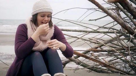 Sad woman crying in front of ocean slow ... | Stock Video | Pond5