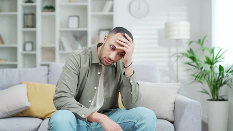 Sad young adult man suffering from depre... | Stock Video | Pond5