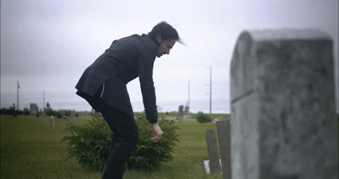 Sad young man kneeling, grieving over lo... | Stock Video | Pond5