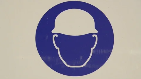 A safety helmet sign on panel near const... | Stock Video | Pond5