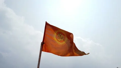 A saffron colored Hindu flag flying duri... | Stock Video | Pond5