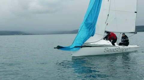 Sailboat opening the main sail getting r... | Stock Video | Pond5
