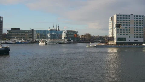 Sailing vessels in city channel | Stock Video | Pond5