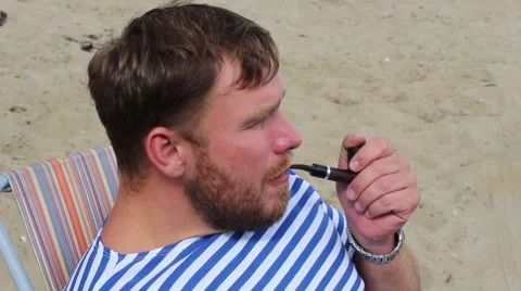sailor smoking a pipe, sitting near the ... | Stock Video | Pond5