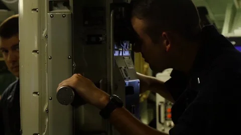Sailor using periscope aboard fast attac... | Stock Video | Pond5