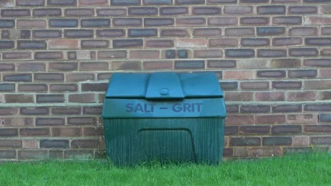 Salt and grit in the box by the brick wa... | Stock Video | Pond5