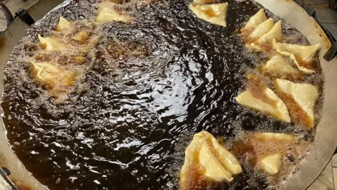 Samosas Cooking in Ghee in Big Pan Favou... | Stock Video | Pond5
