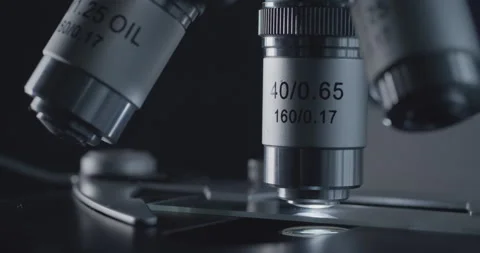 Sample slide and microscope with metal l... | Stock Video | Pond5