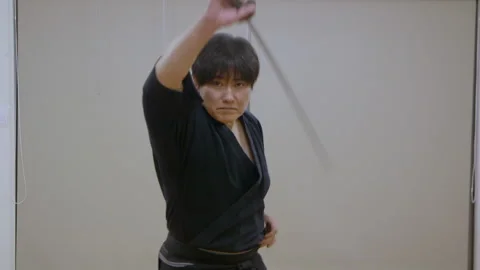 Samurai in gym training, pulling out his... | Stock Video | Pond5