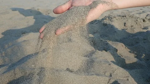 sand falling from hand sand coming down ... | Stock Video | Pond5