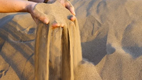 sand falling from hand sand coming down ... | Stock Video | Pond5