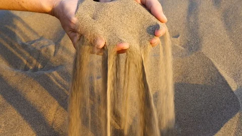 sand falling from hand sand coming down ... | Stock Video | Pond5