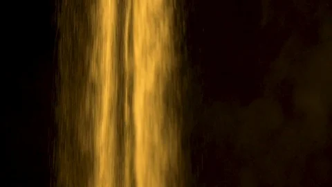 Sand falling in slow motion on dark blac... | Stock Video | Pond5