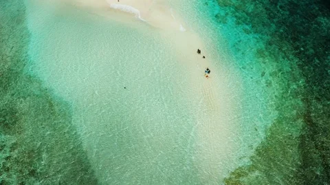 Sandy island with a beach and tourists. ... | Stock Video | Pond5