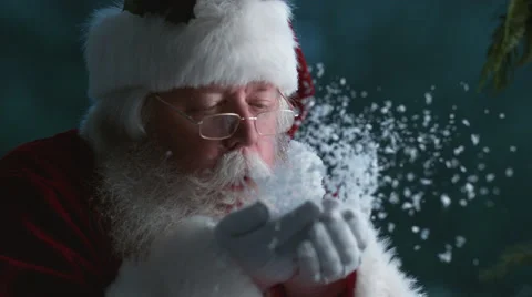 Santa Claus blowing snow from hands in s... | Stock Video | Pond5
