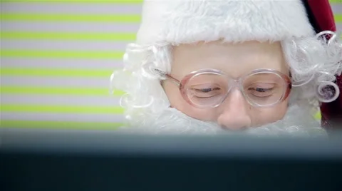 Santa Claus at the computer | Stock Video | Pond5