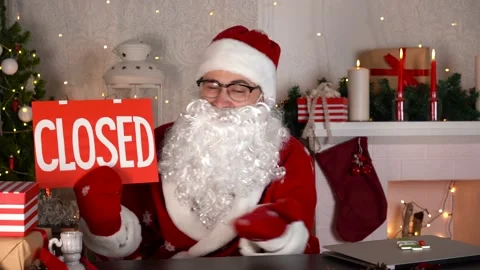 Santa Claus holding closed sign gets sad... | Stock Video | Pond5