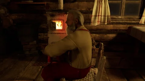 Santa Claus inside his Log Cabin Sits by... | Stock Video | Pond5
