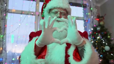 Santa Claus making gesture of love with ... | Stock Video | Pond5
