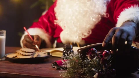 Santa Claus writing notes, working at ni... | Stock Video | Pond5